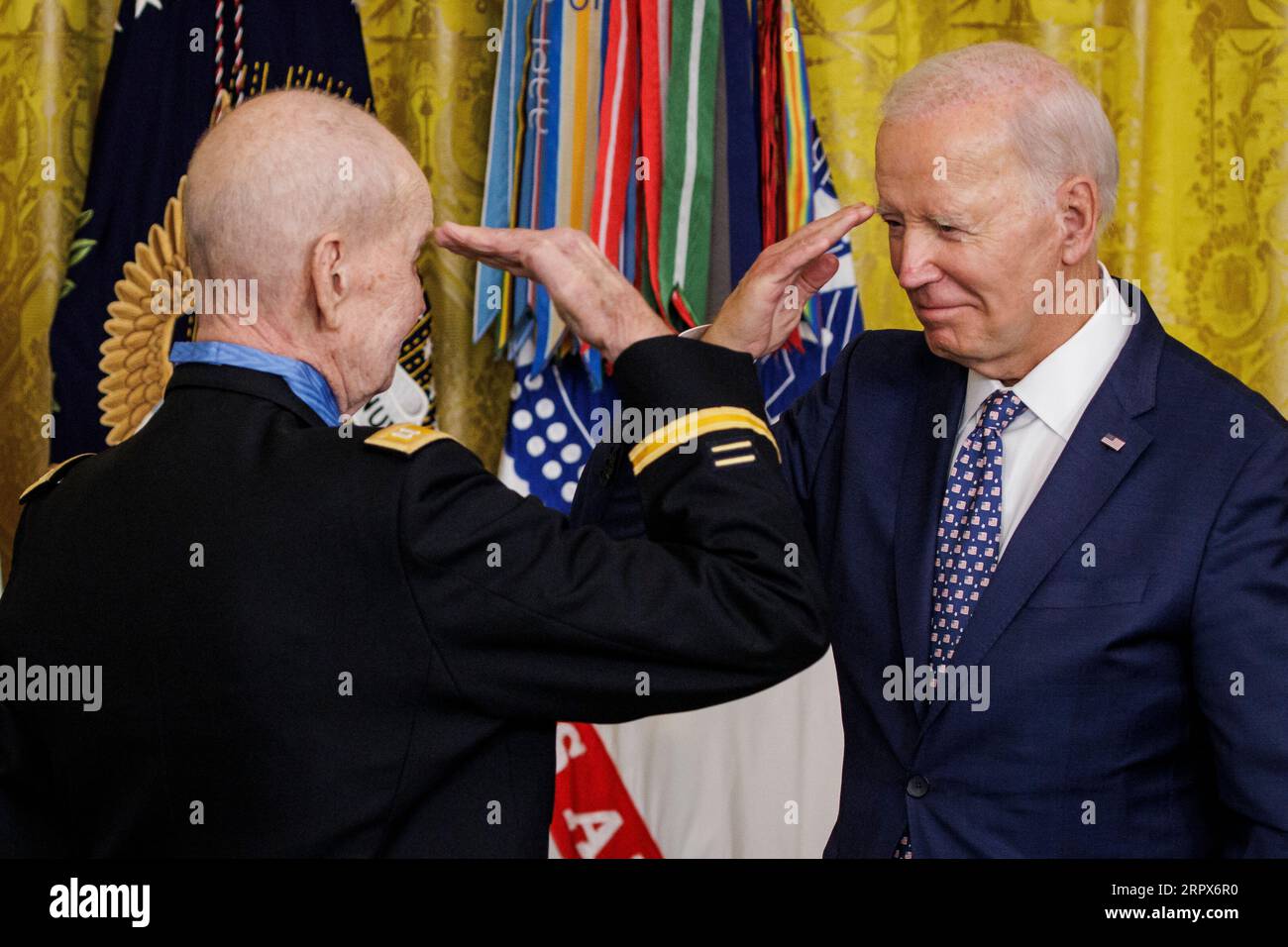 United States President Joe Biden returns U.S. Army Captain Larry ...