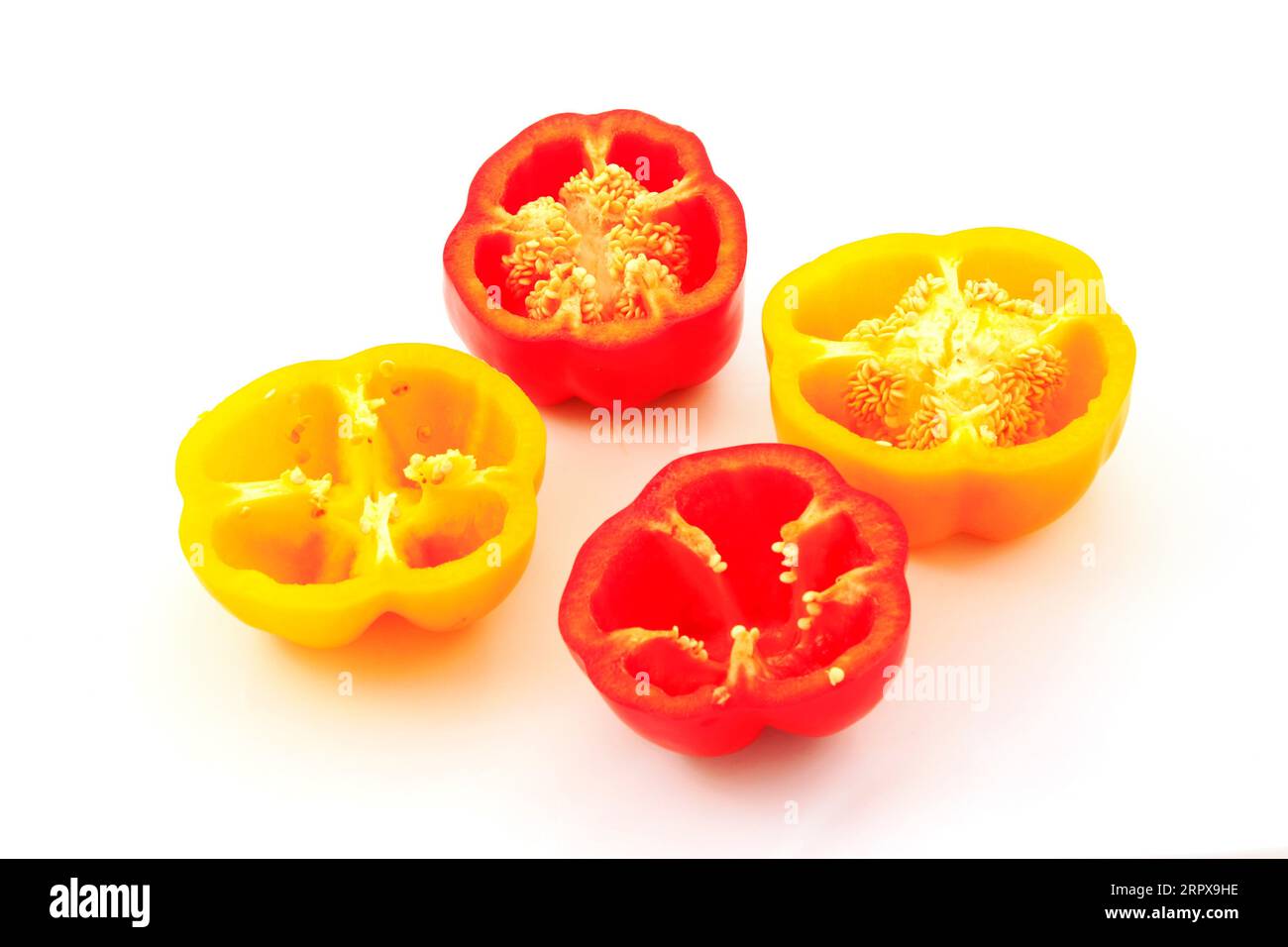 color pepper cross section on a clean white background Stock Photo - Alamy