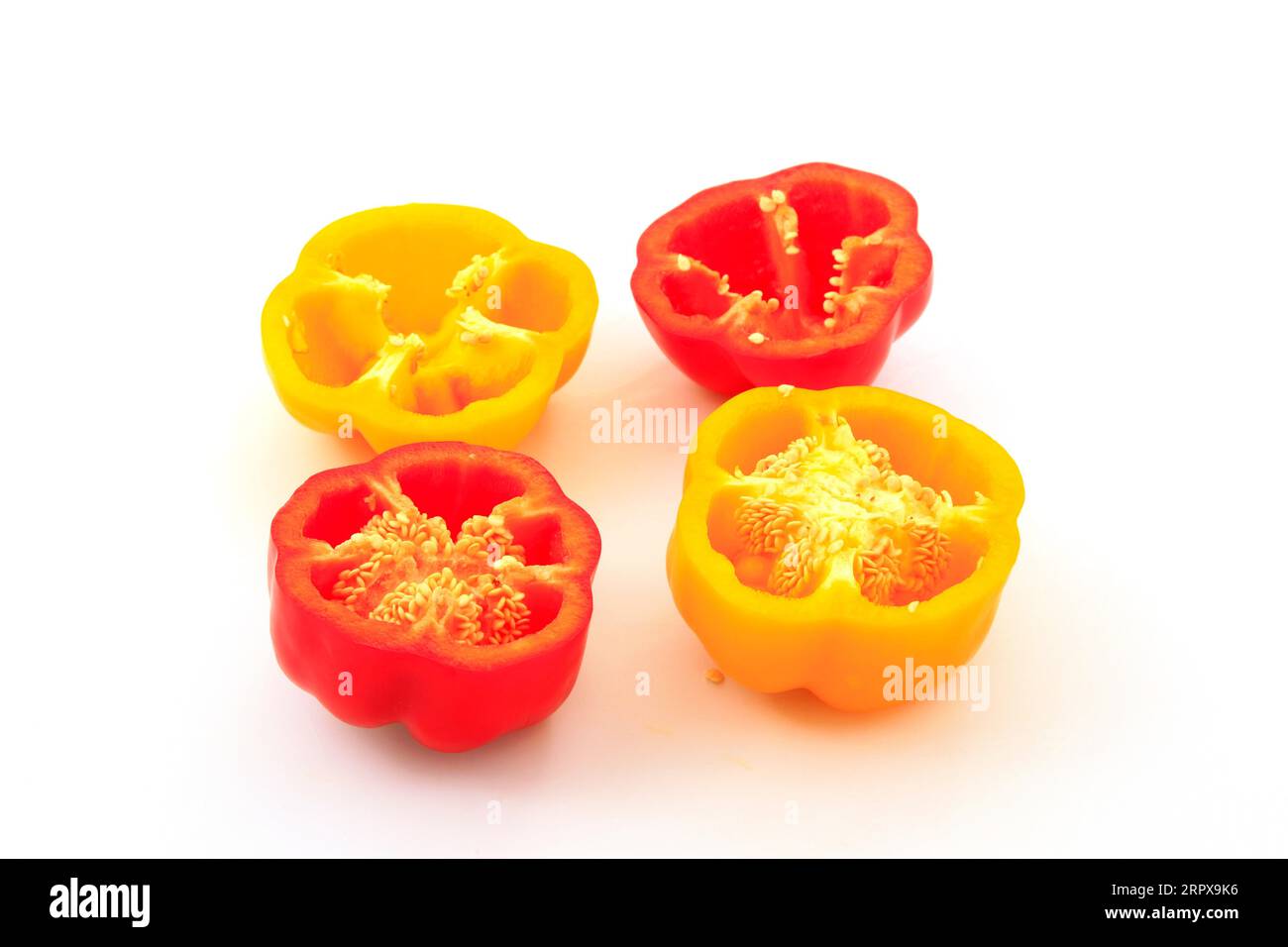 color pepper cross section on a clean white background Stock Photo - Alamy