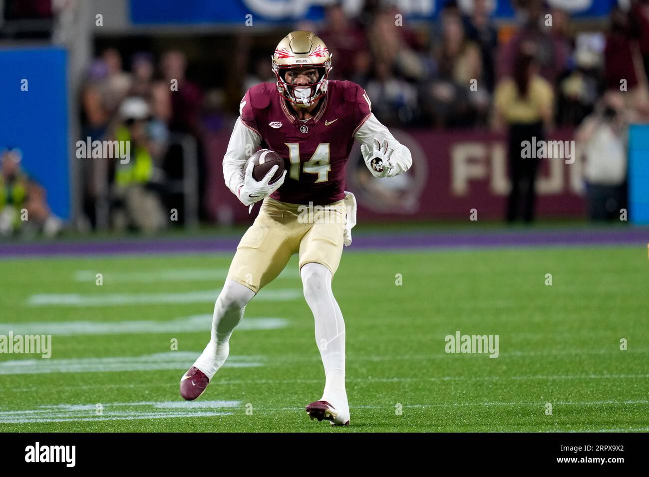 Florida State wide receiver Johnny Wilson (14) runs after a reception ...