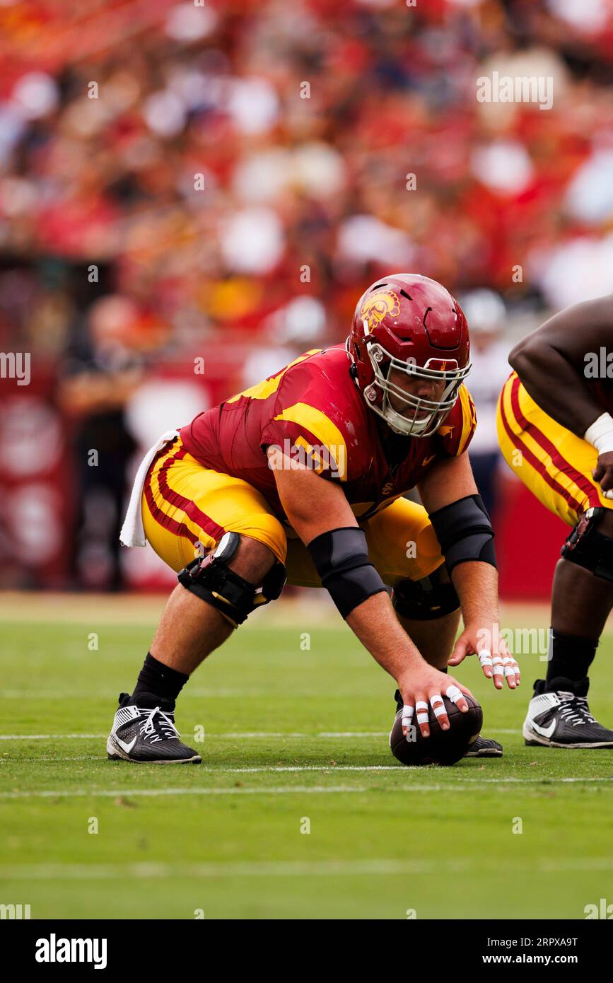 USC Trojans offensive lineman Justin Dedich (57) in an offensive stance ...