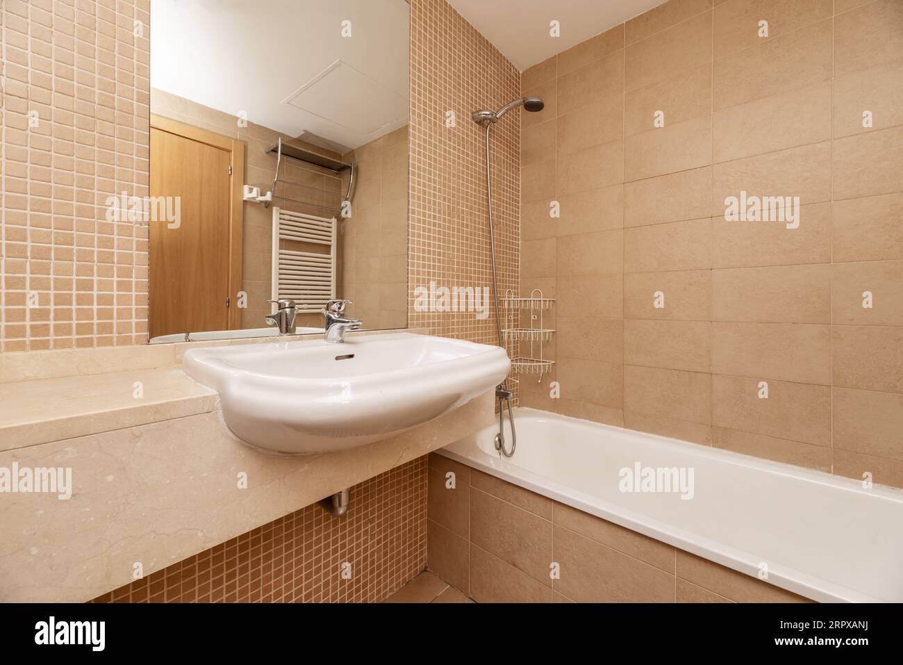 Corner of a bathroom with a marble countertop with a mirror embedded in ...