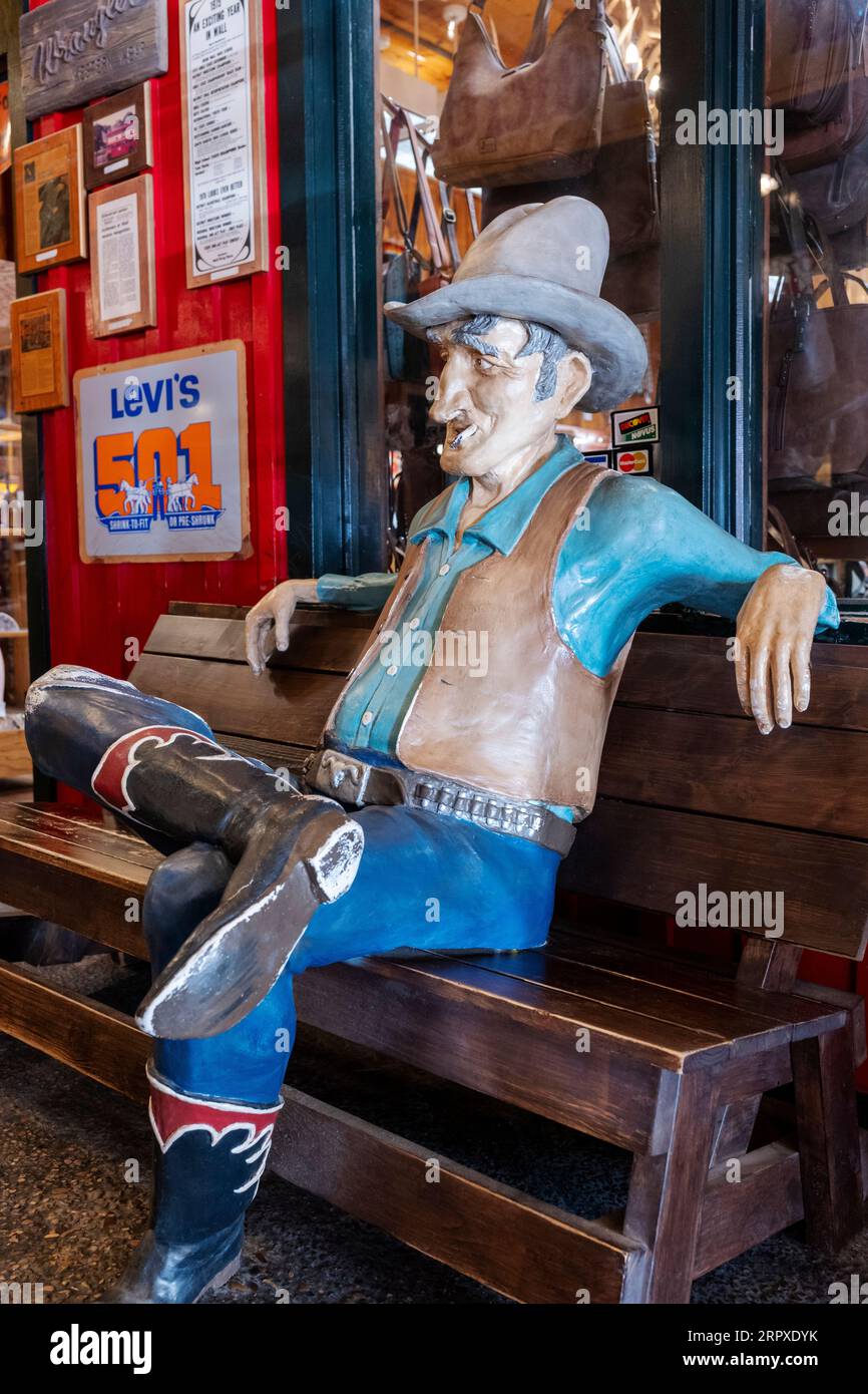 Statue of old cowboy seated on bench; Wall Drug Store; Third Generation ...