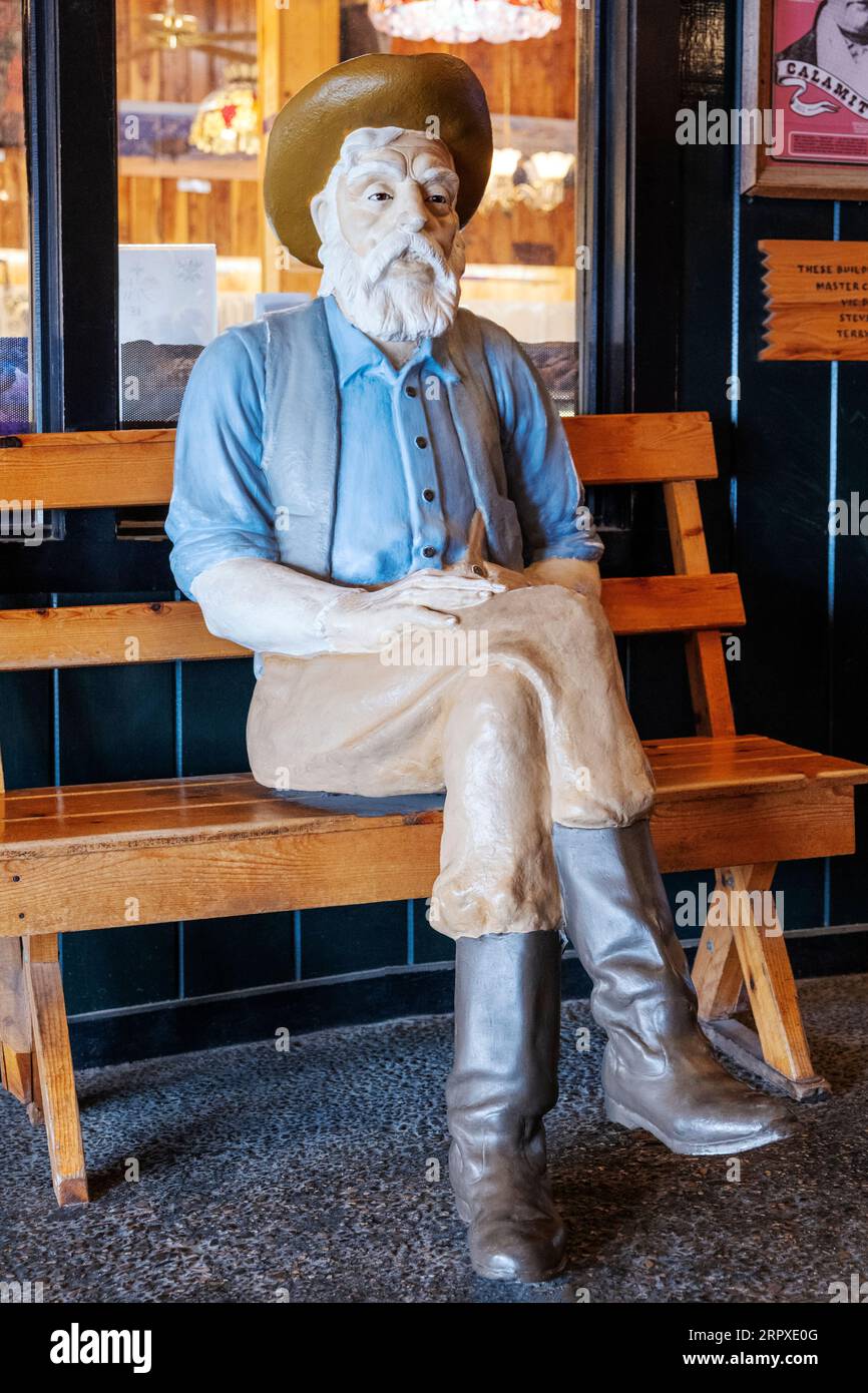 Statue of old cowboy seated on bench; Wall Drug Store; Third Generation ...