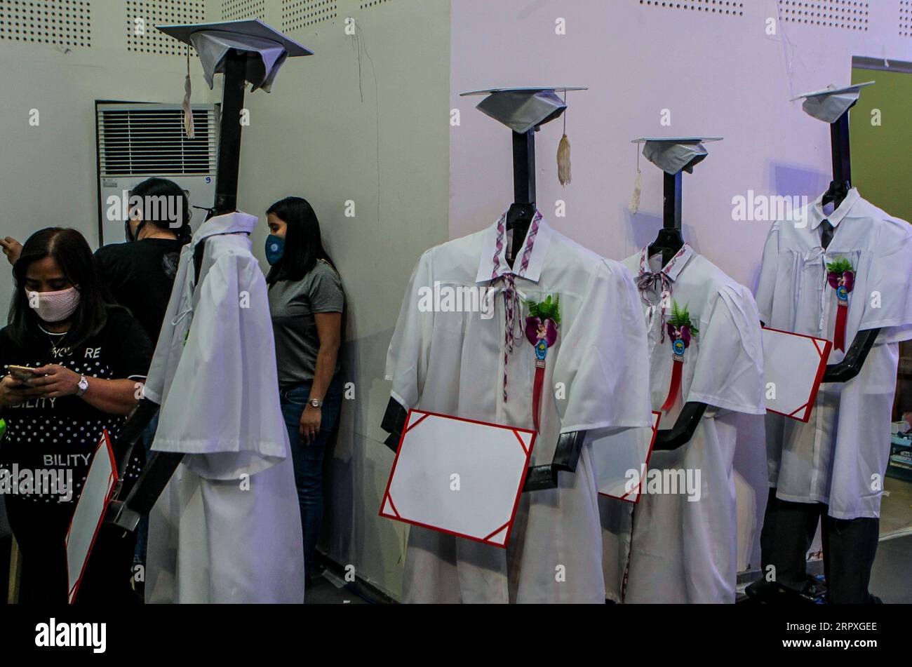 200522 -- MANILA, May 22, 2020 -- Robots wearing white graduation togas ...