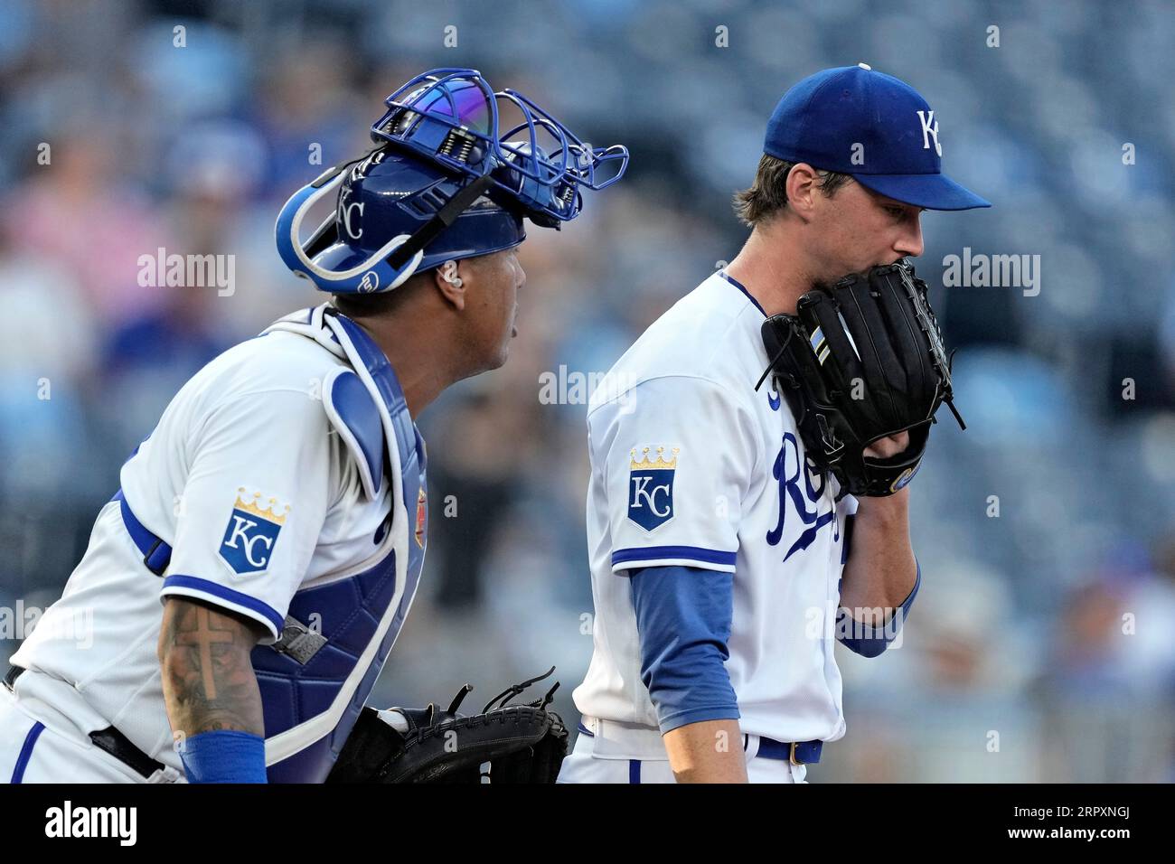 Kansas City Royals catcher Salvador Perez, left, talks to starting ...