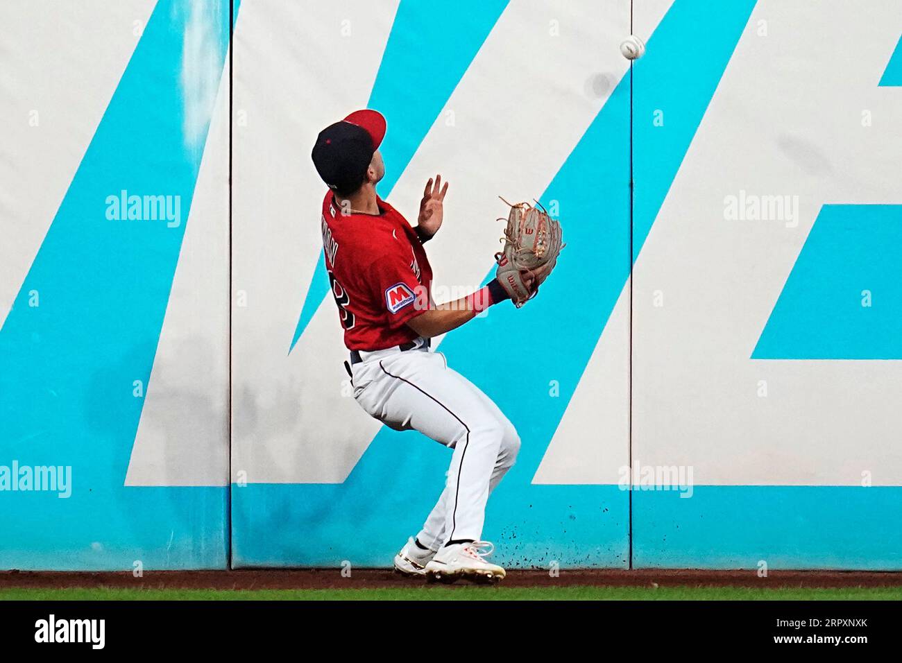 Cleveland Guardians left fielder Steven Kwan watches a ball hit for a ...
