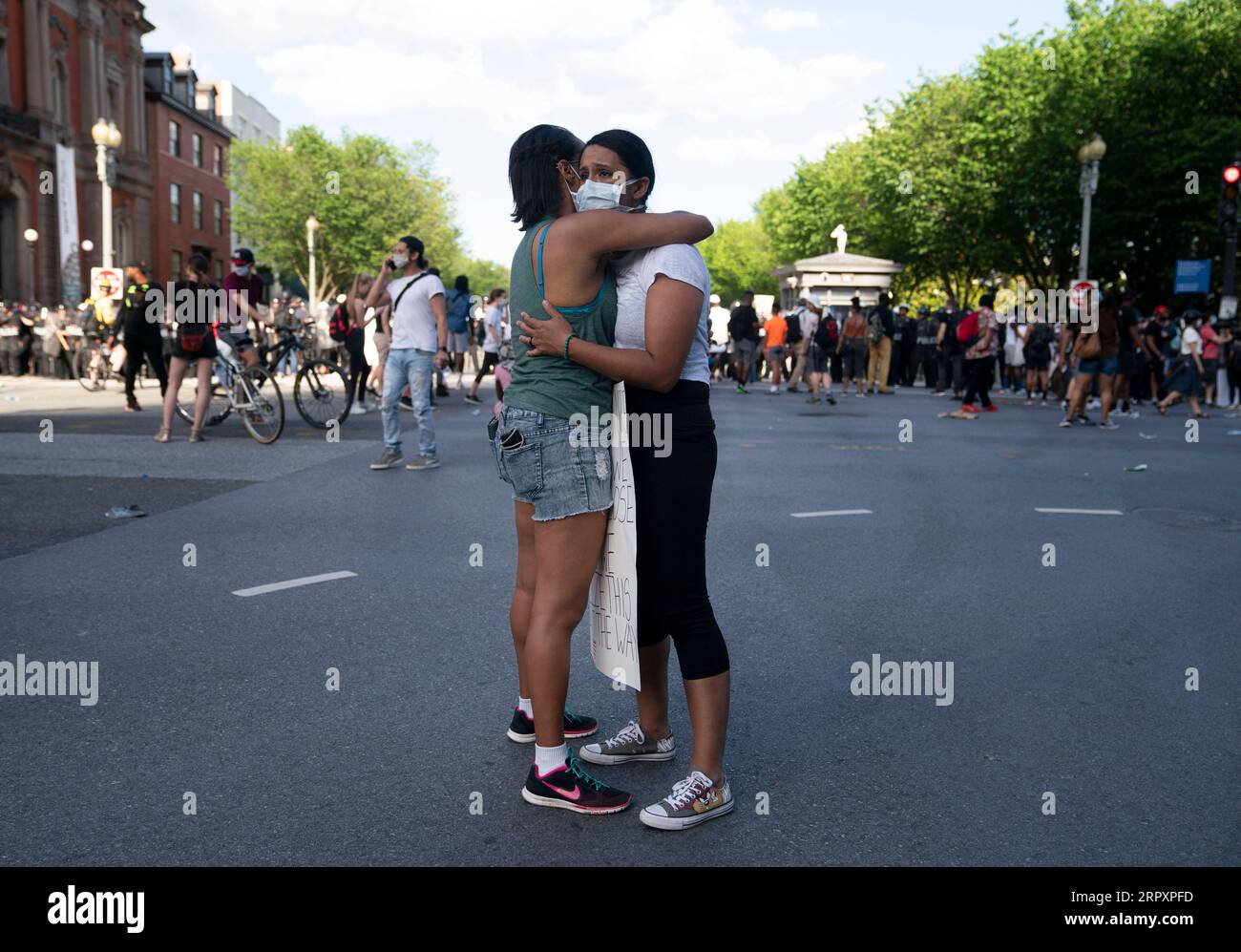 Police hug hi-res stock photography and images - Alamy