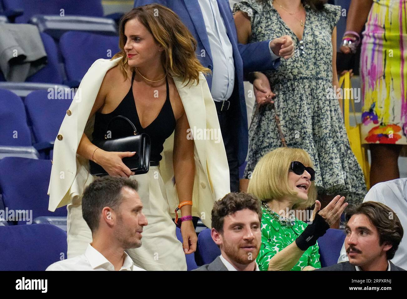 Emma Watson, left, and Anna Wintour, right, settle in to watch play ...