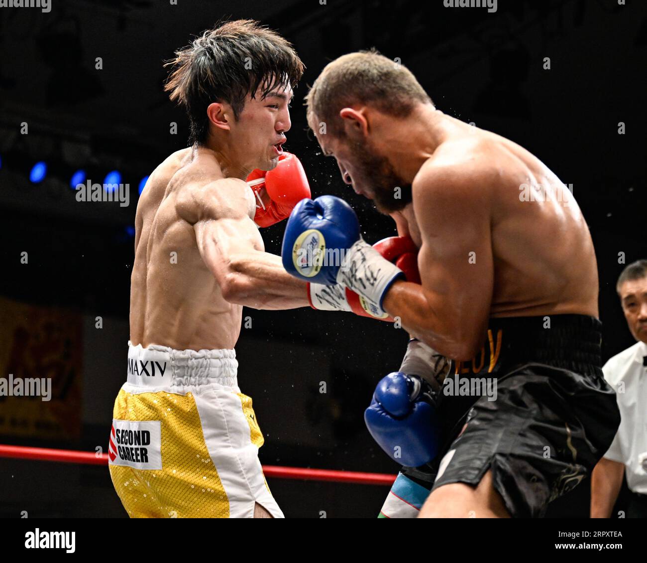Tokyo, Japan. 30th Aug, 2023. Japan's Koki Inoue (red gloves) throws a right at Uzbekistan's ...