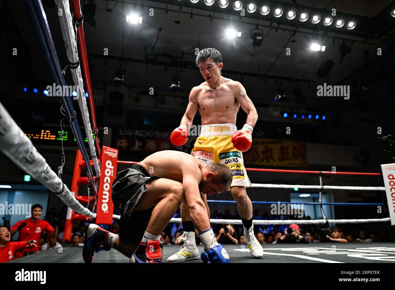 Tokyo, Japan. 30th Aug, 2023. Japan's Koki Inoue (red gloves) knocks down Uzbekistan's Abdurasul ...