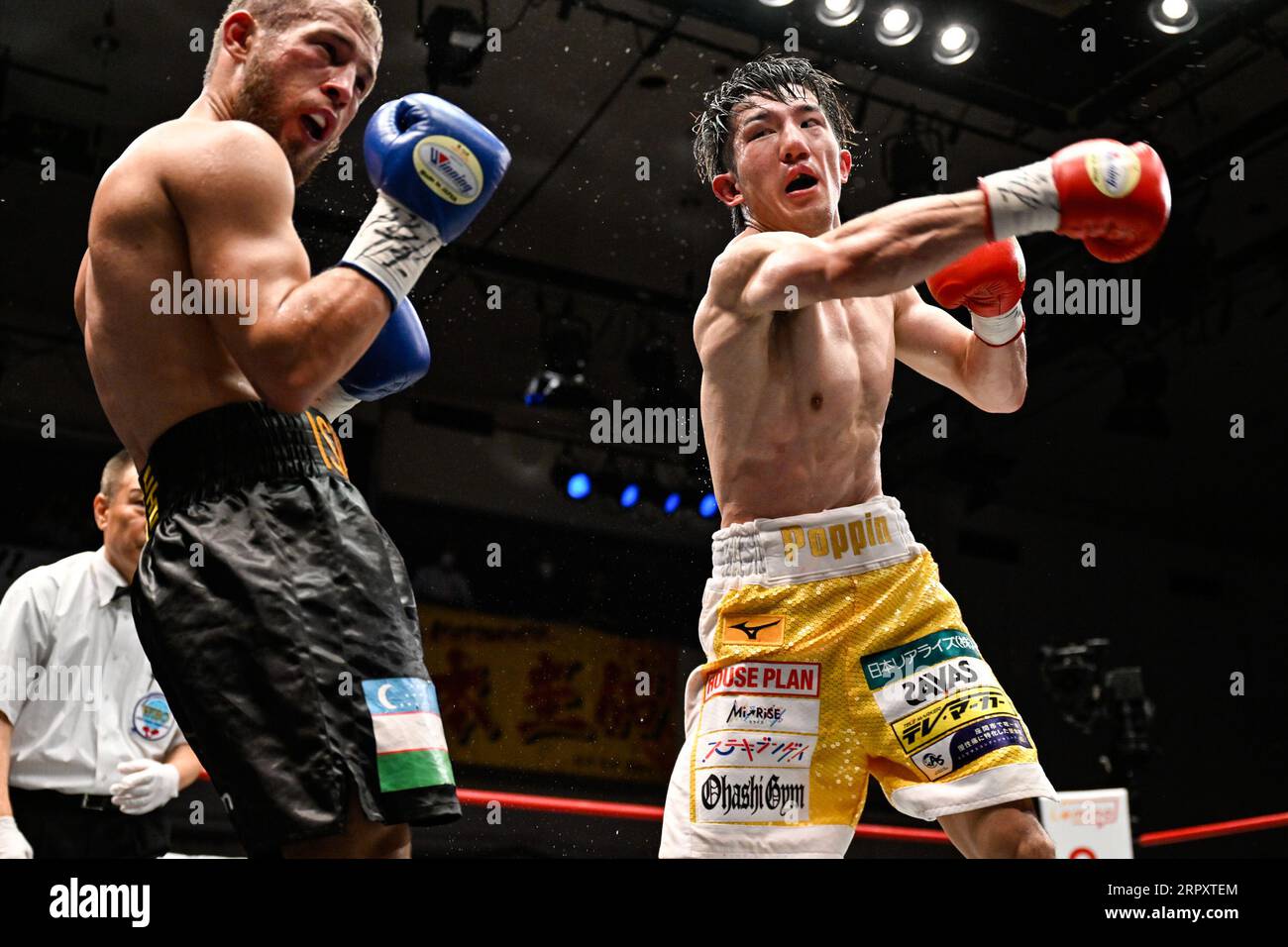Tokyo, Japan. 30th Aug, 2023. Japan's Koki Inoue (red gloves) throws a right at Uzbekistan's ...