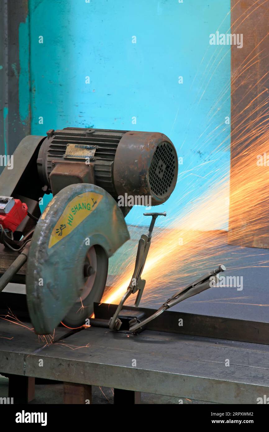 Mechanical cutting steel with sparks fly in a workshop Stock Photo - Alamy