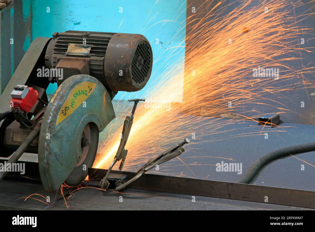Mechanical cutting steel with sparks fly in a workshop Stock Photo - Alamy