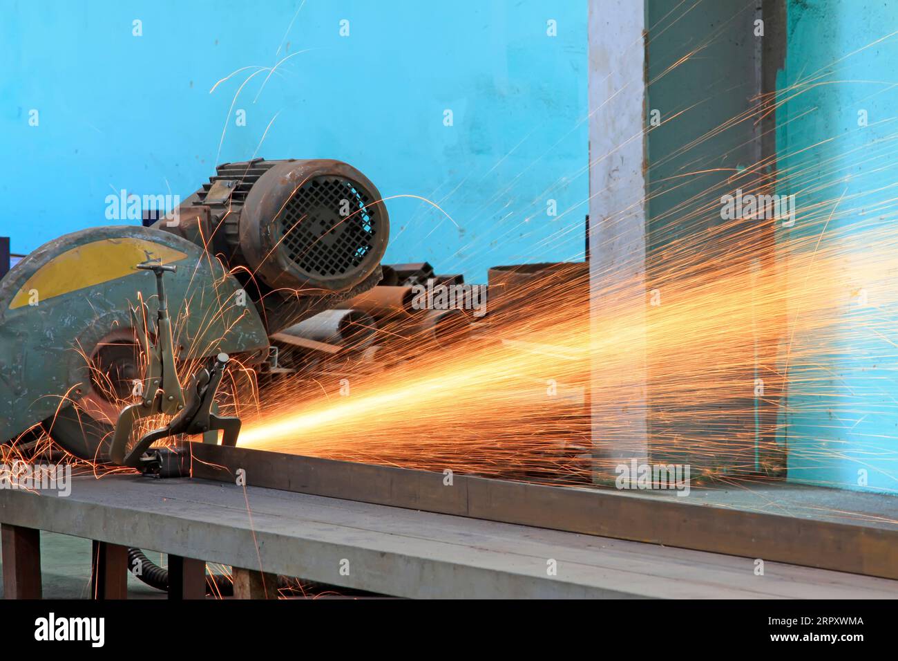 Mechanical cutting steel with sparks fly in a workshop Stock Photo - Alamy