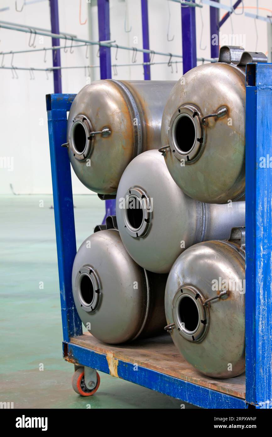 Stainless steel pressure tank piling up together, closeup of photo ...