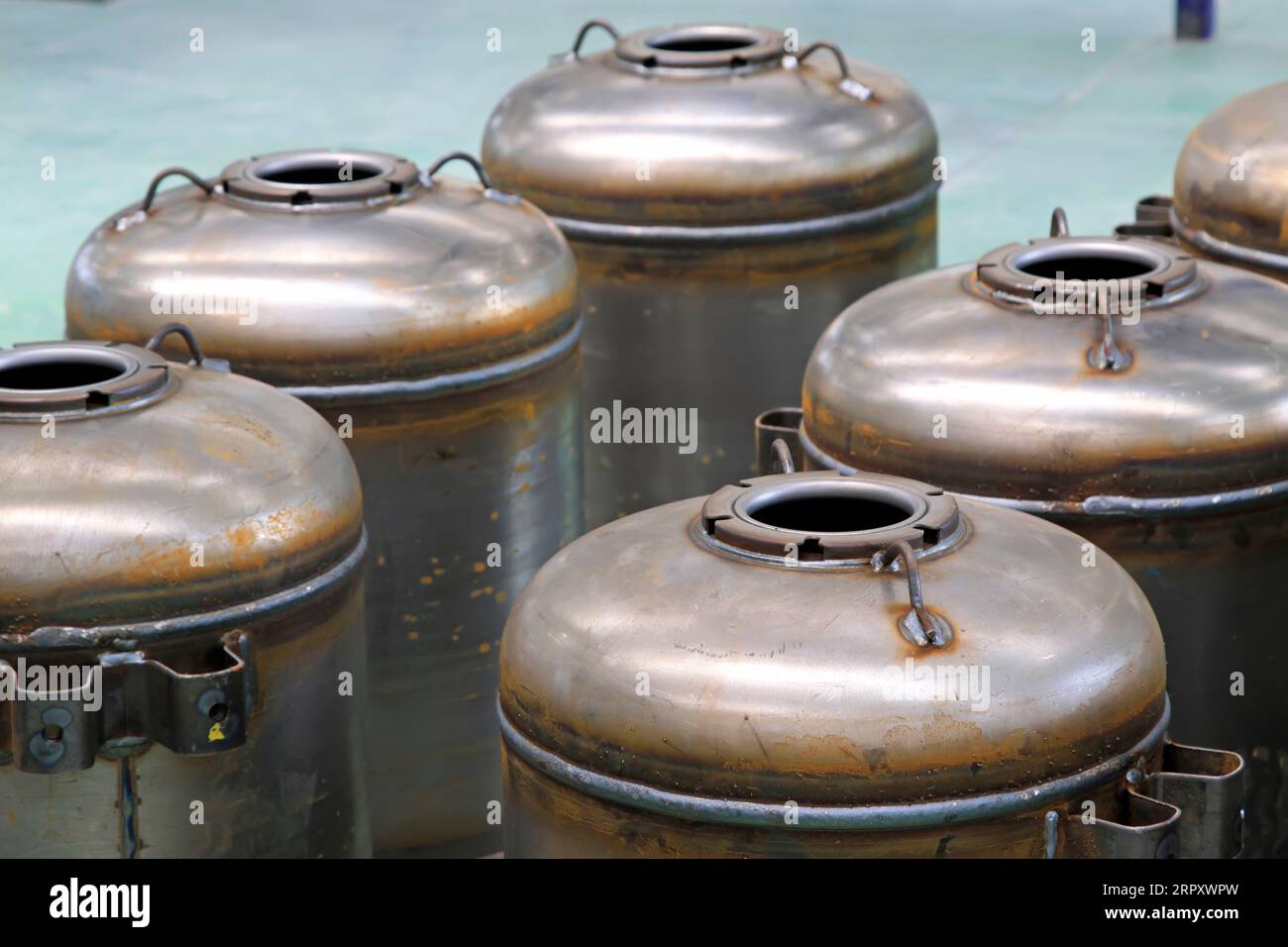 Stainless steel pressure tanks in a production workshop, closeup of ...