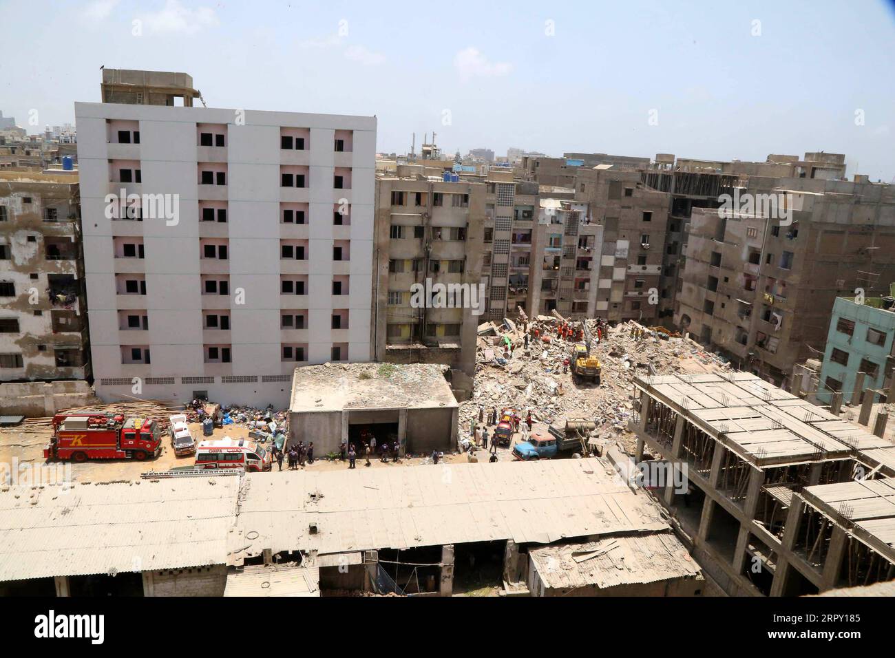 200609 -- KARACHI PAKISTAN, June 9, 2020 -- Rescuers work at the site ...