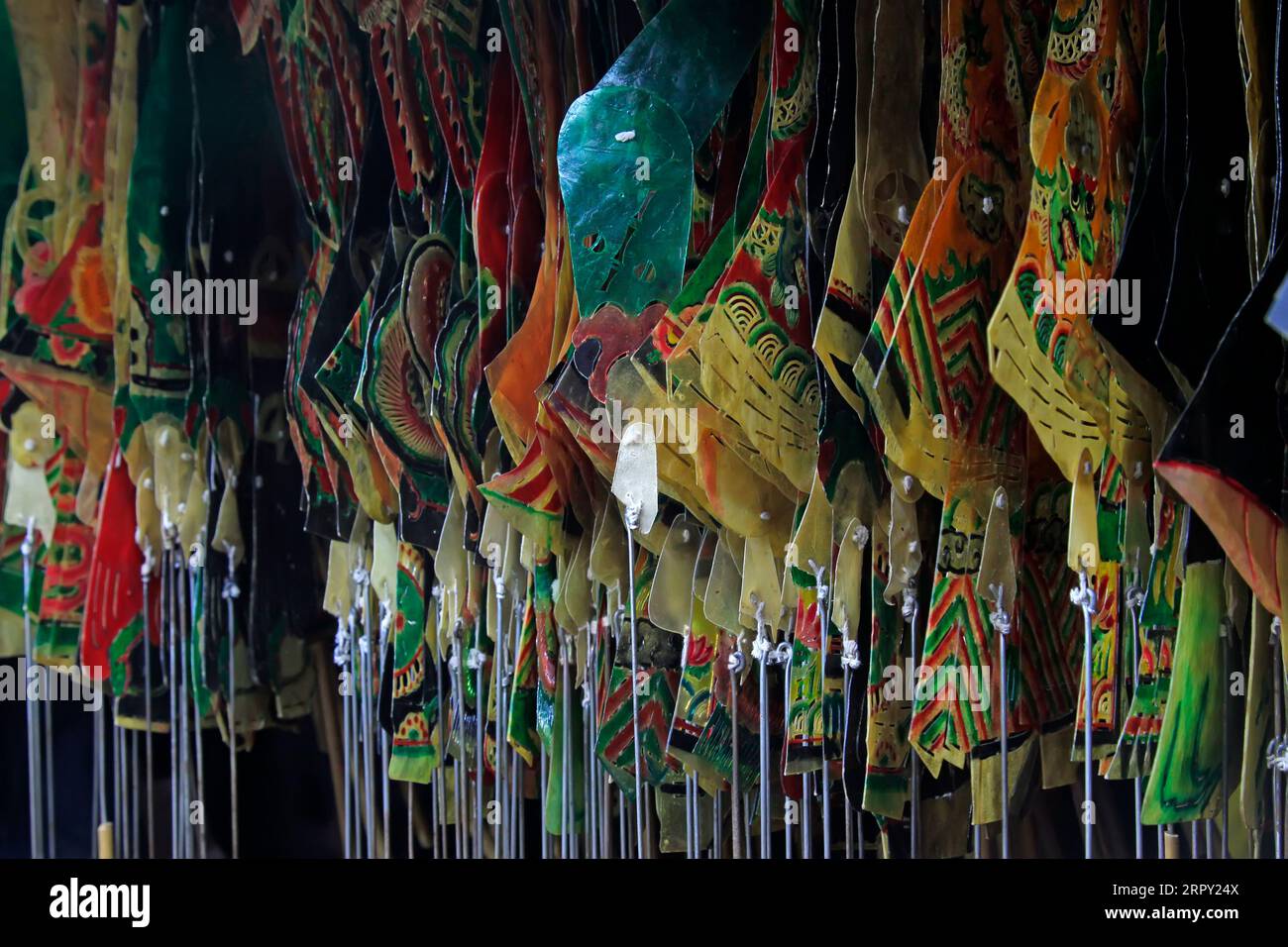 Chinese shadow play props hanging in the night, closeup of photo Stock ...