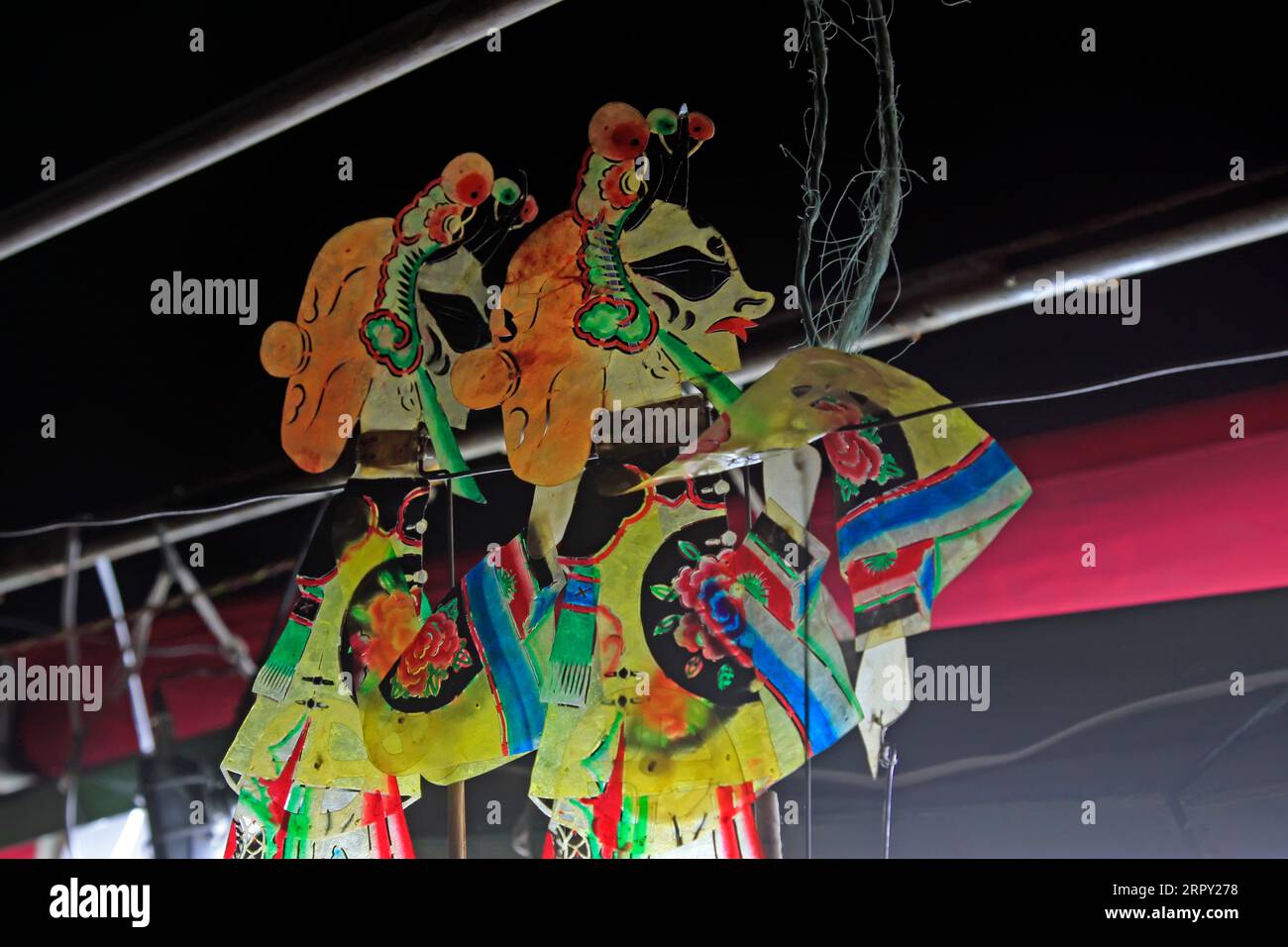 Chinese shadow play props hanging in the night, closeup of photo Stock ...
