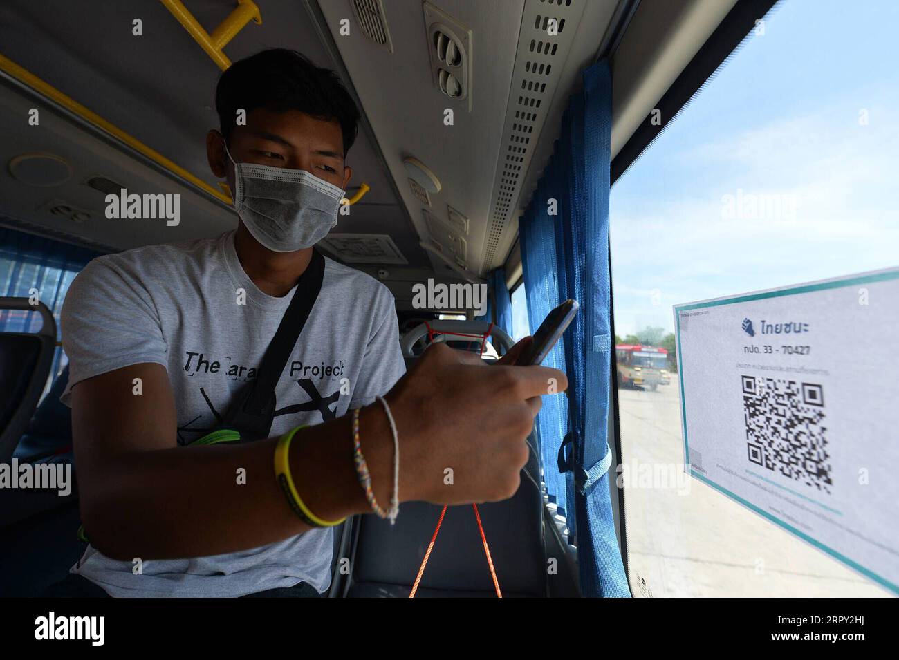 200611 -- BANGKOK, June 11, 2020 -- A passenger scans a QR code of a ...