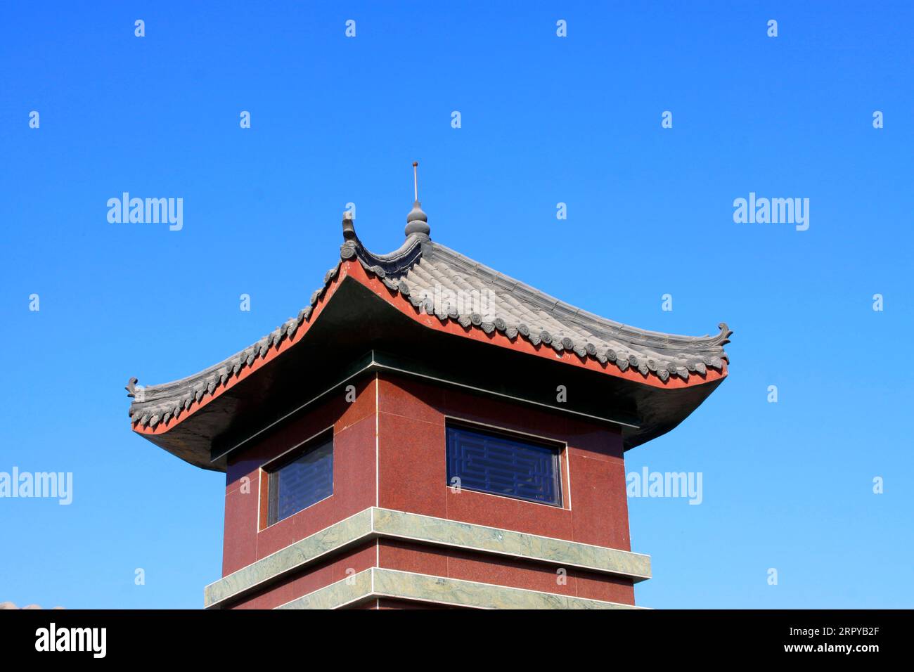 Chinese architectural style tower under blue sky, closeup of photo ...