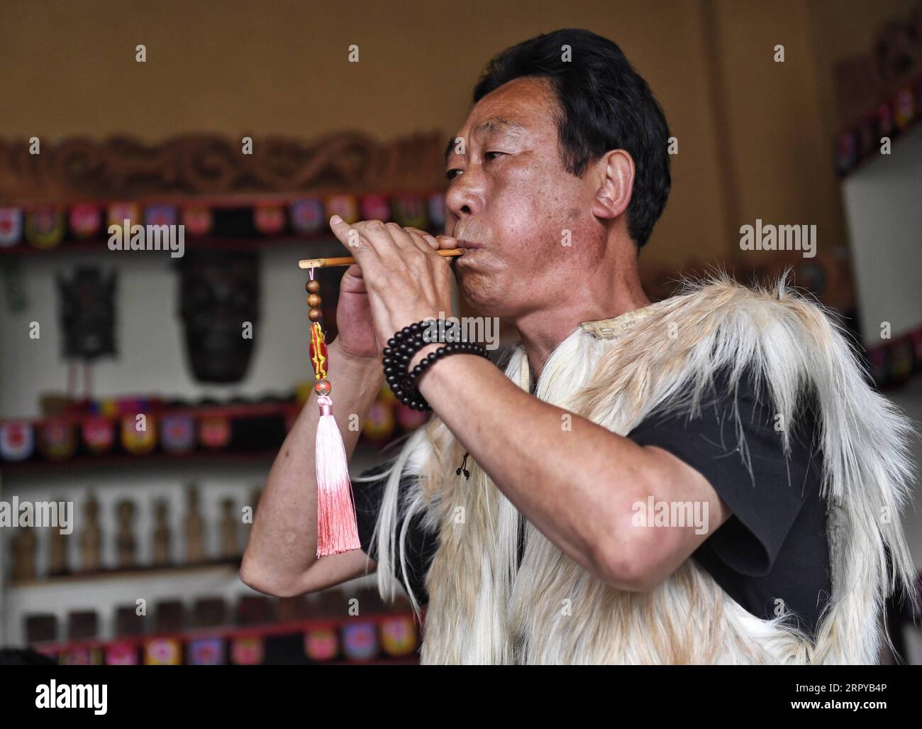 200623 -- MAOXIAN, June 23, 2020 -- Artist He Wangjin plays flute of ...