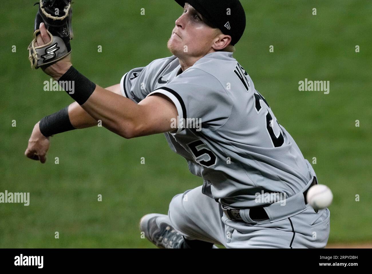 Chicago White Sox first baseman Andrew Vaughn tries to control the ball ...