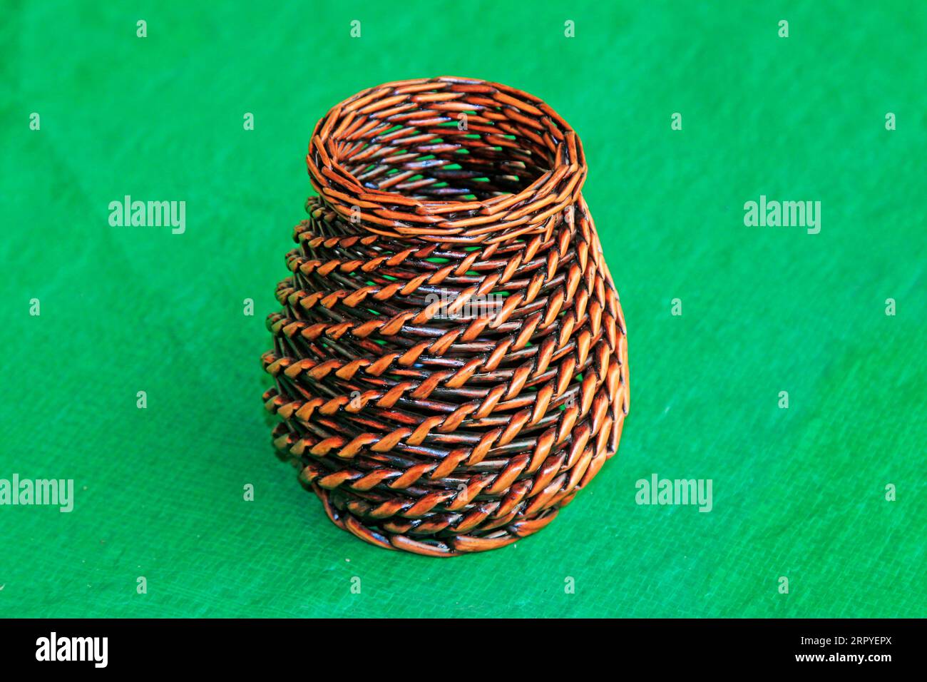 rattan weaving objects on green background Stock Photo - Alamy