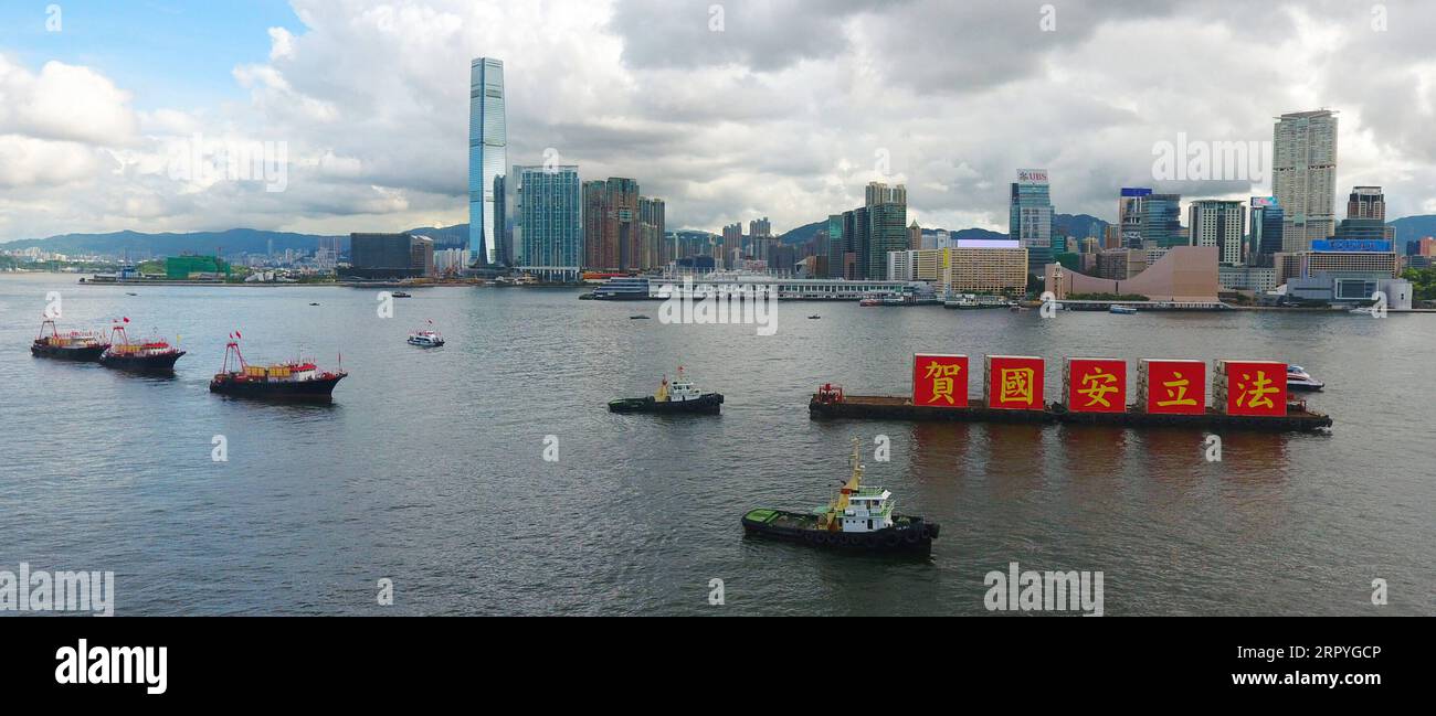 200701 -- HONG KONG, July 1, 2020 -- A ship carrying the slogan of ...