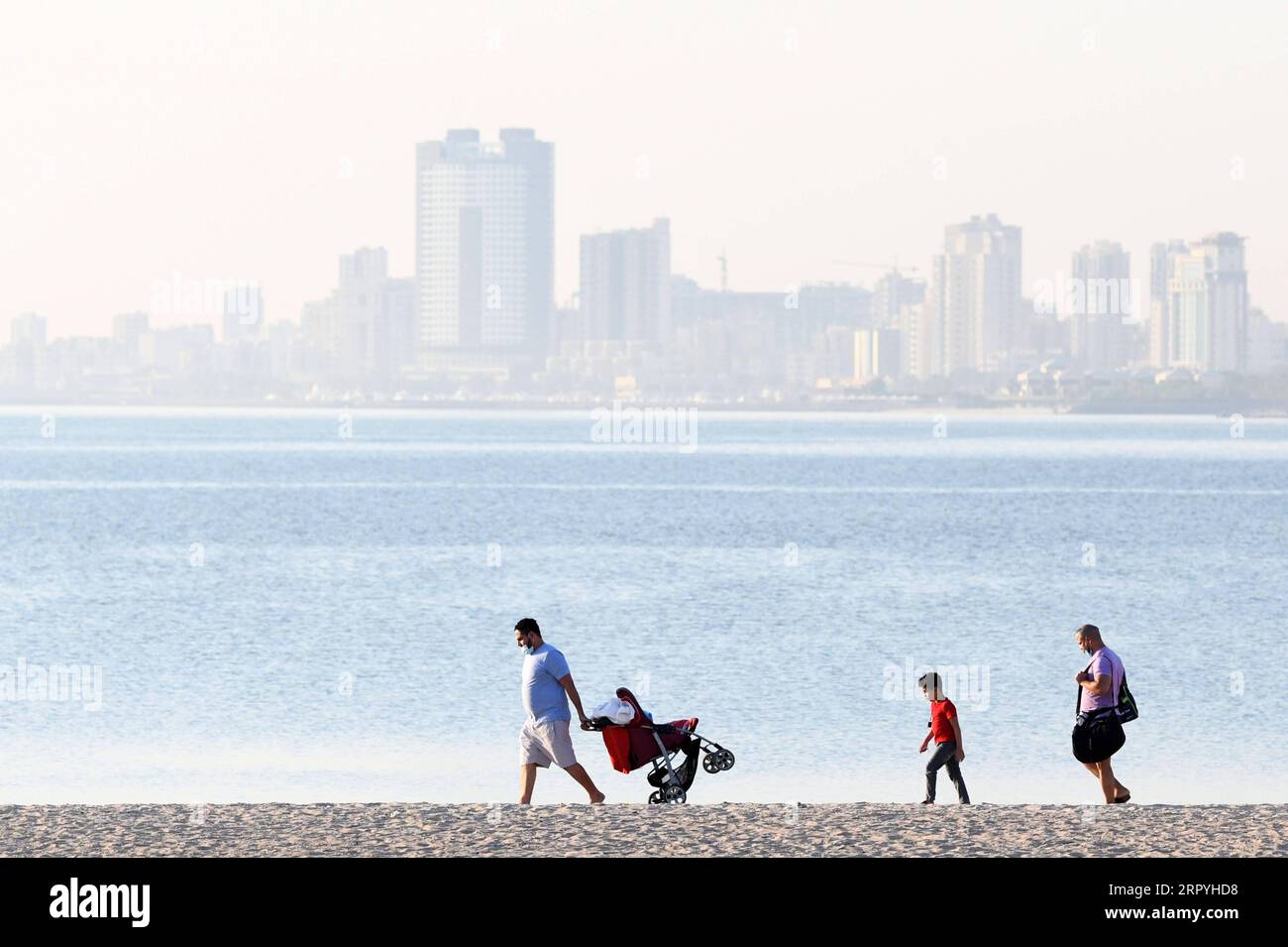 200703 -- KUWAIT CITY, July 3, 2020 Xinhua -- People walk at the beach ...