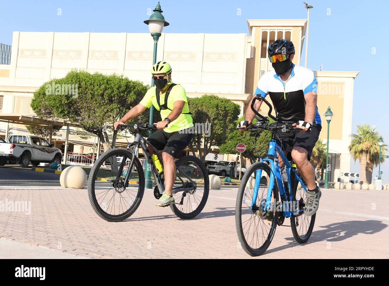 200703 -- KUWAIT CITY, July 3, 2020 Xinhua -- People ride bicycles in ...