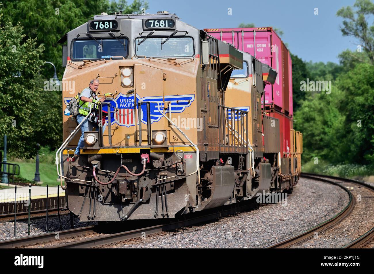 Winfield, Illinois, USA. An engineer climbs the lead locomotive of a ...