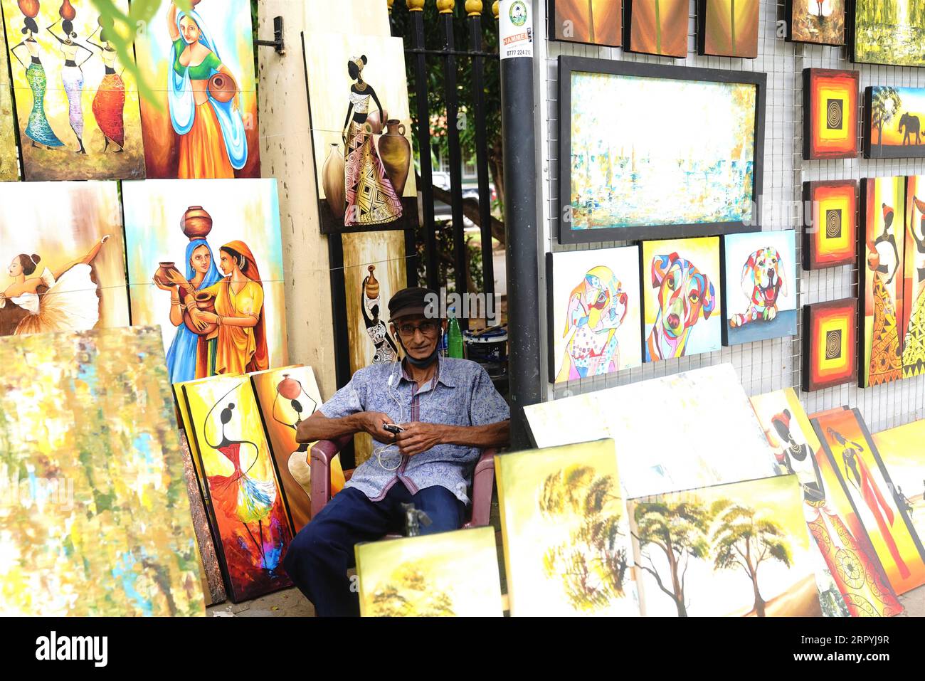 200704 -- COLOMBO, July 4, 2020 -- An artist is seen with his artworks ...