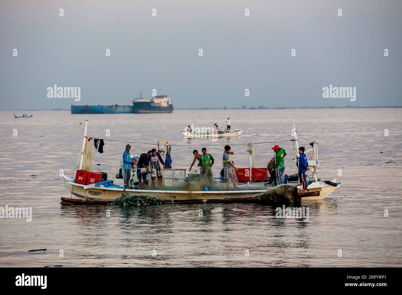 200714 -- MANILA, July 14, 2020 -- Fishermen prepare to catch fish on ...