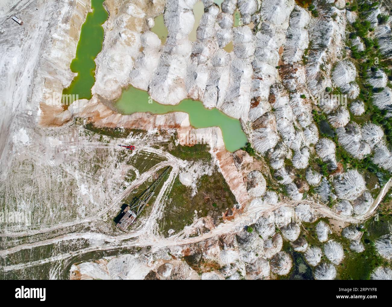 Rows of chalk piles machinery and ponds at mining quarry Stock Photo ...