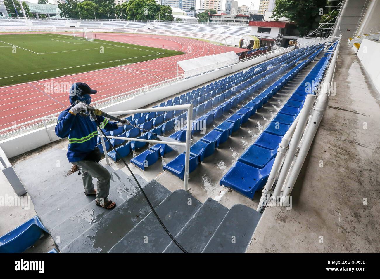 200730 -- MANILA, July 30, 2020 -- A staff member sprays disinfectant ...