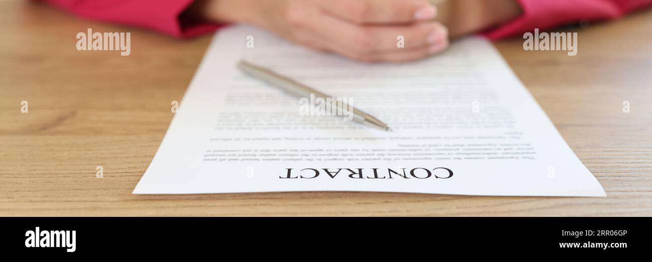 Woman signing contract in office hi-res stock photography and images ...