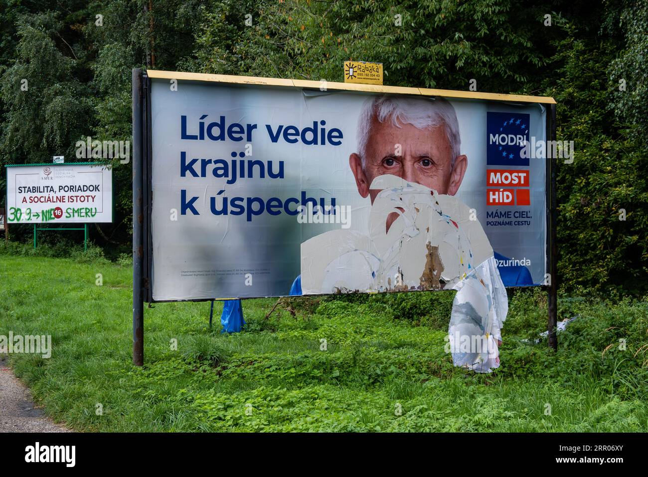 The election billboard for the Modri Most-Hid party displays the face ...