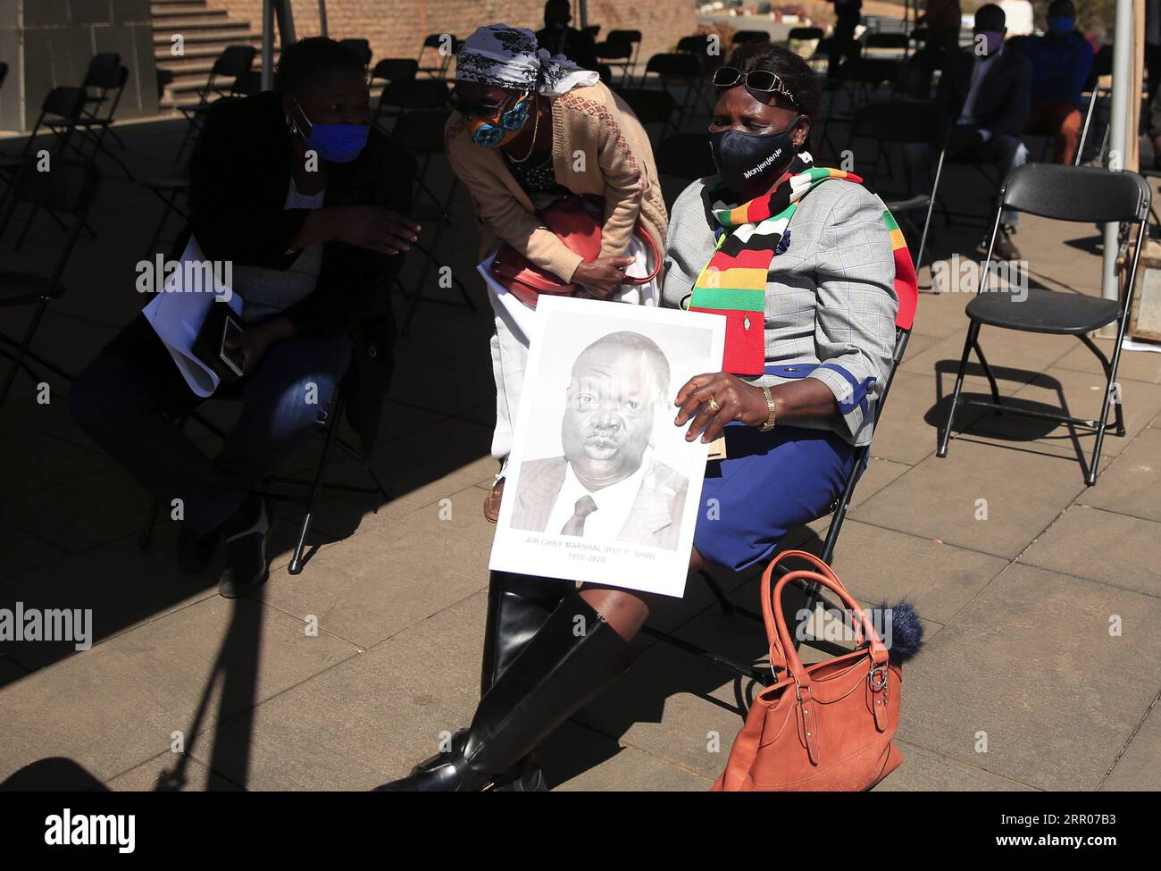200801 -- HARARE, Aug. 1, 2020 Xinhua -- A lady holds a portrait of ...