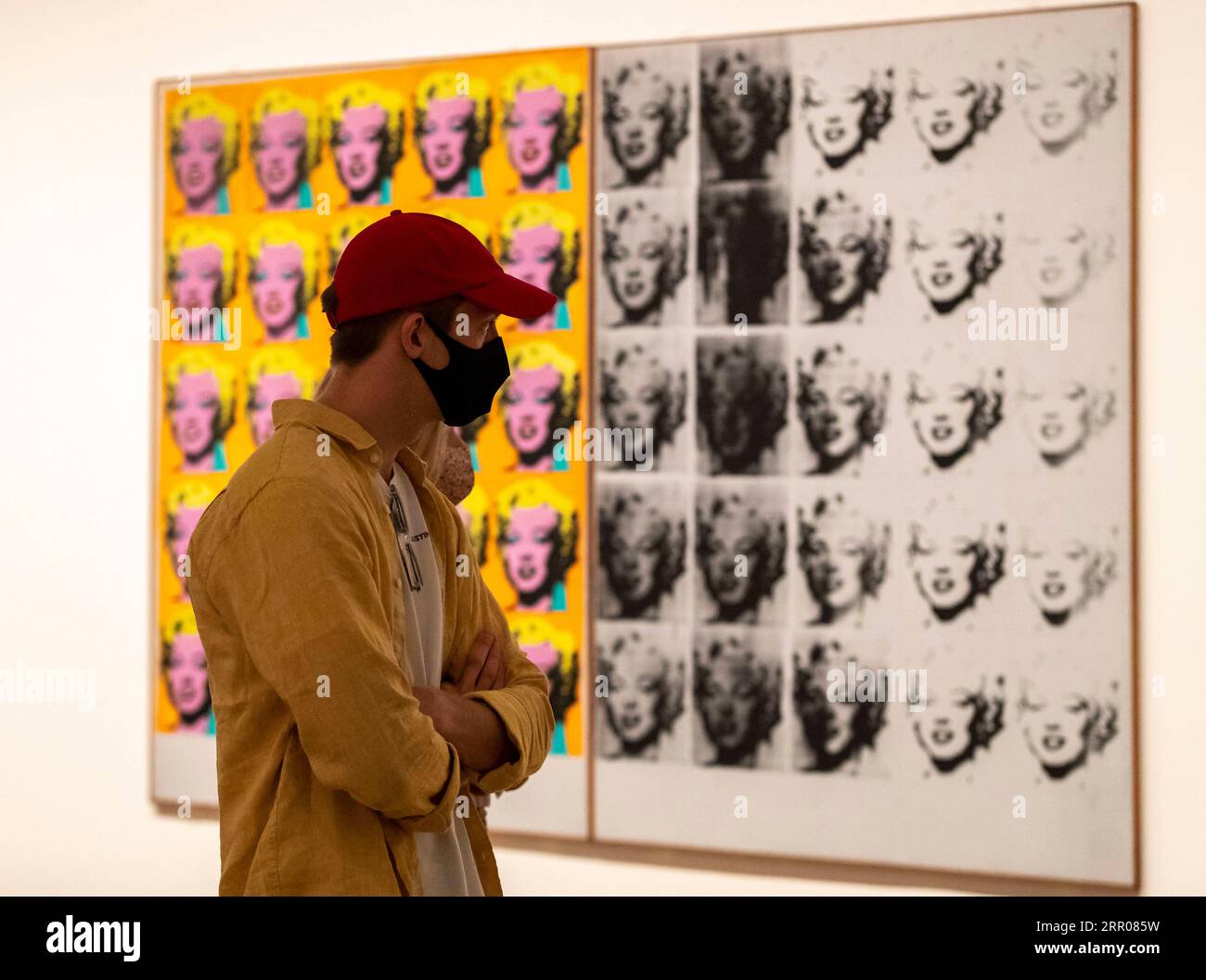200802 -- LONDON, Aug. 2, 2020 -- A visitor wearing a face mask walks ...