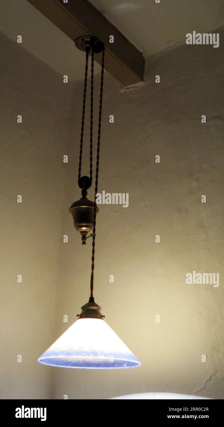 Cord and pulley ceiling light in Andalusian home Stock Photo - Alamy