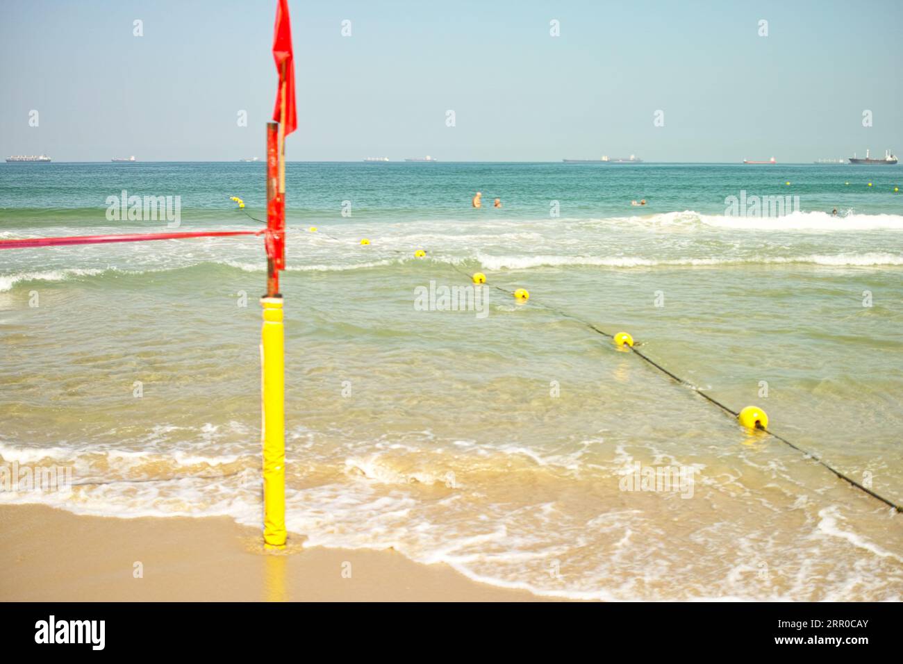 safety buoys attached on the ropes and red flad on the stick, concept ...