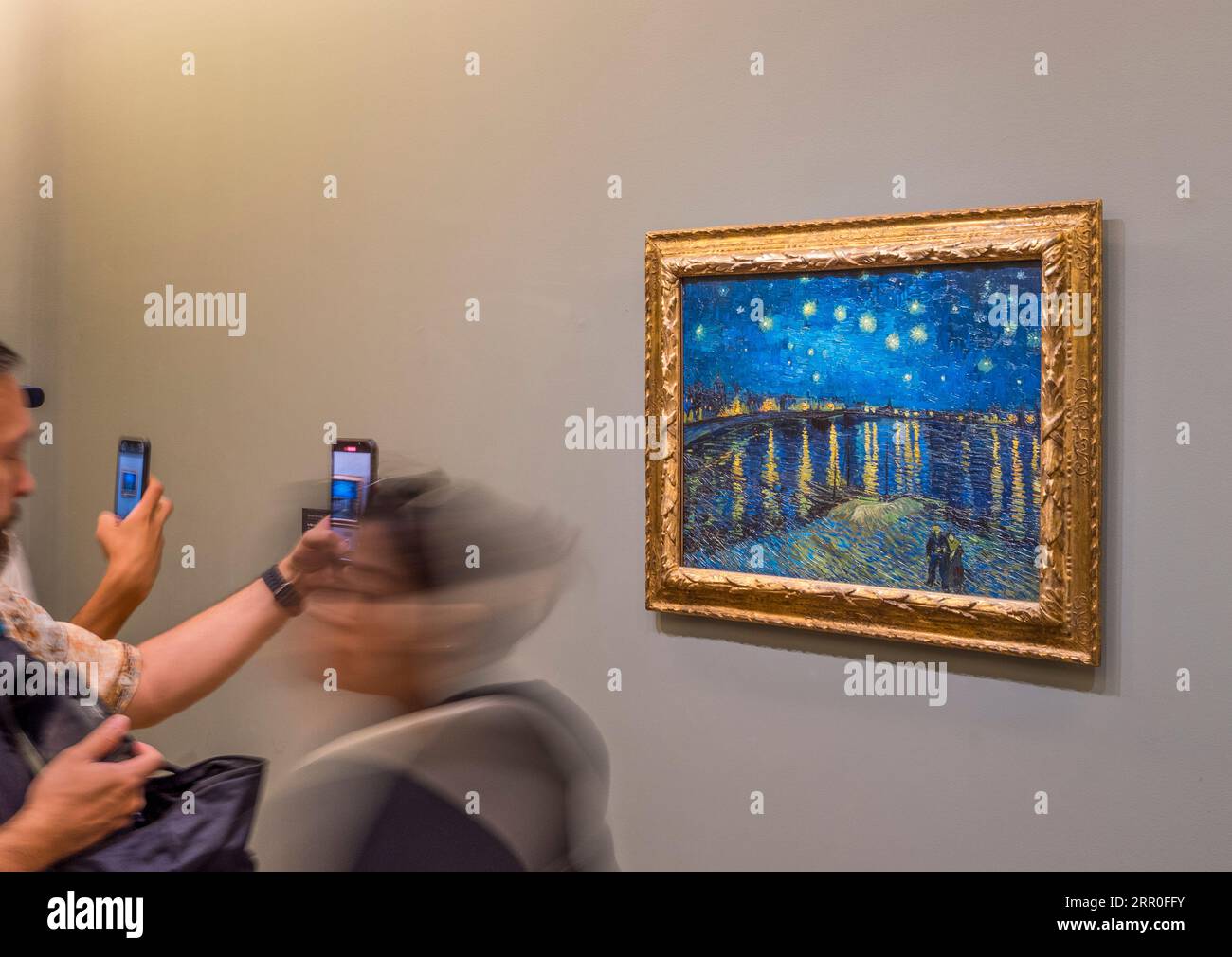 People Looking at Vincent Van Gogh, Starry Night Over the Rhône, Musée ...