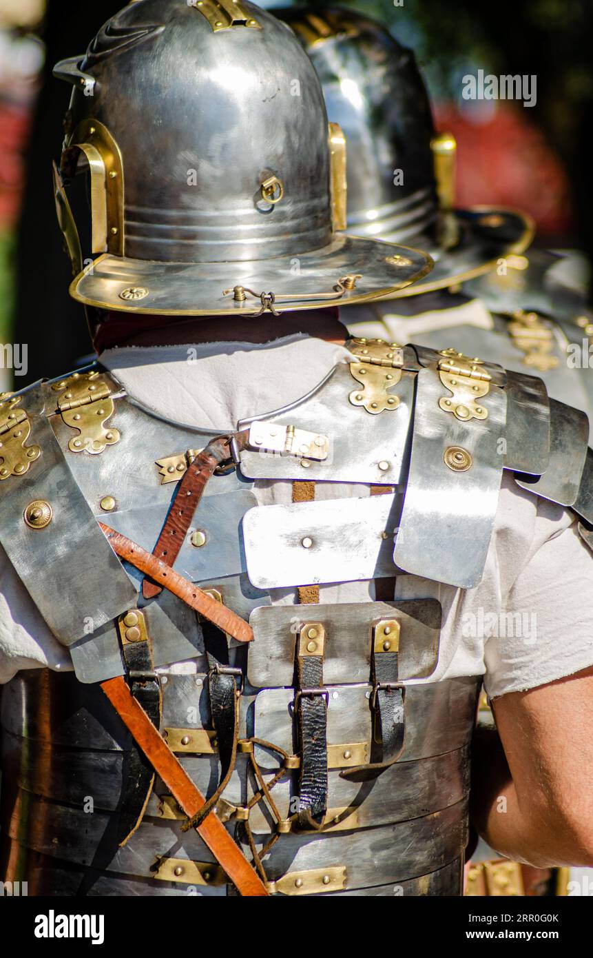 Back view of a Roman legionary in lorica segmentata armor and helmet ...