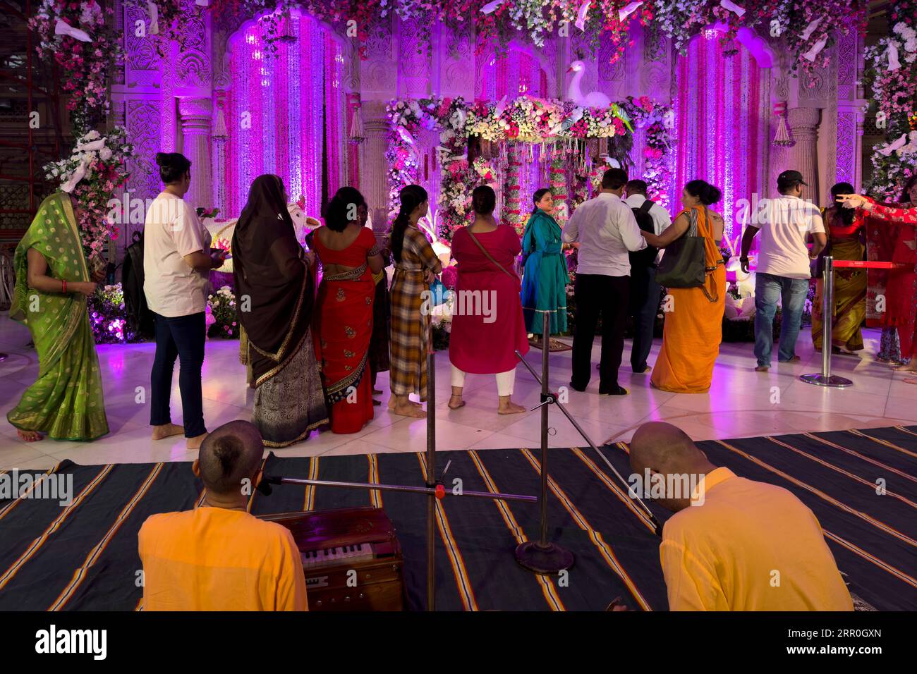 Hare Krishna devotees queue to pray in front of an altar at ISCKON ... Hare Krishna devotees queue to pray in front of an altar at ISCKON ...