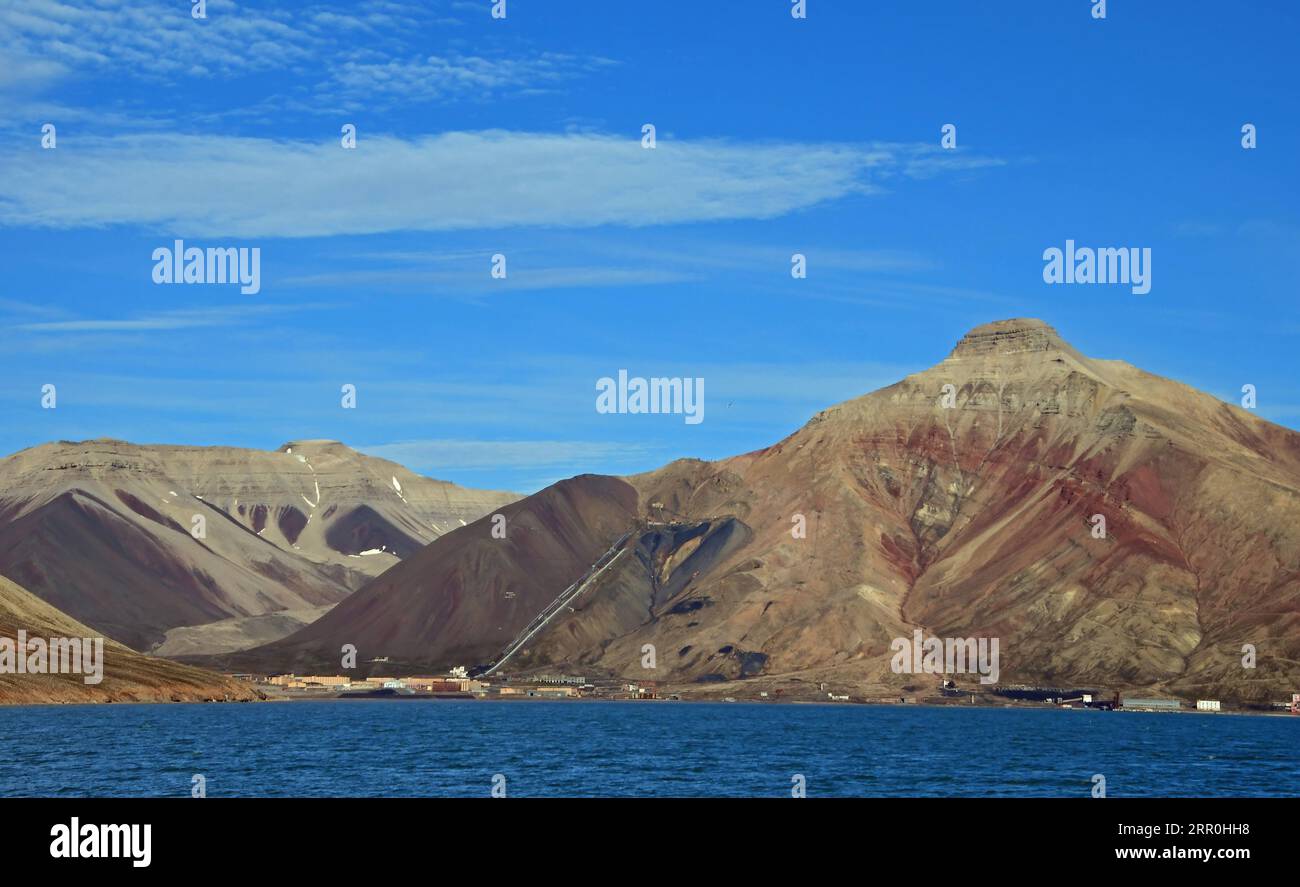 abandoned soviet coal mining town of pyramiden and mountain peak on ...