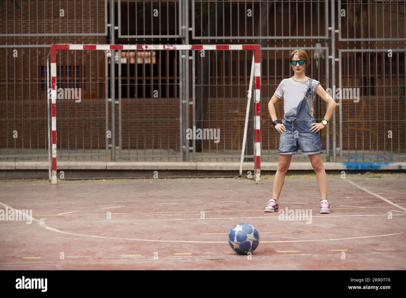 Concentrated on getting a good shot on a cement court Stock Photo - Alamy