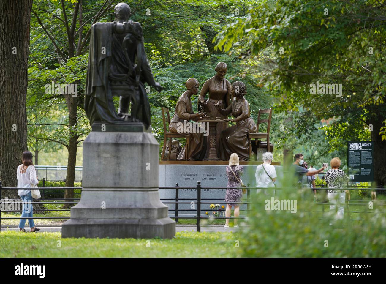 200827 -- NEW YORK, Aug. 27, 2020 -- People look at the statue of women ...