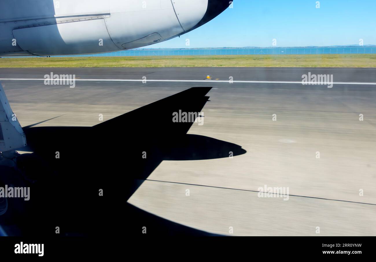 Aircraft wing shadow when taxiing at airport Stock Photo - Alamy